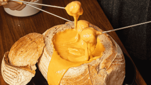 Swiss Fondue: History, Interesting Facts & More - SwitzerLanding